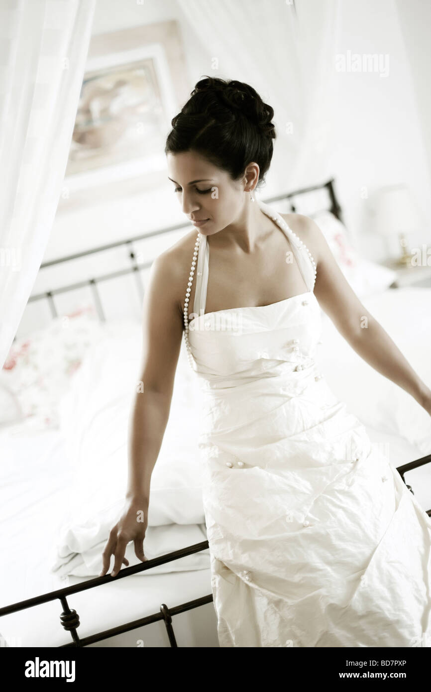 bride leaning on bed Stock Photo - Alamy