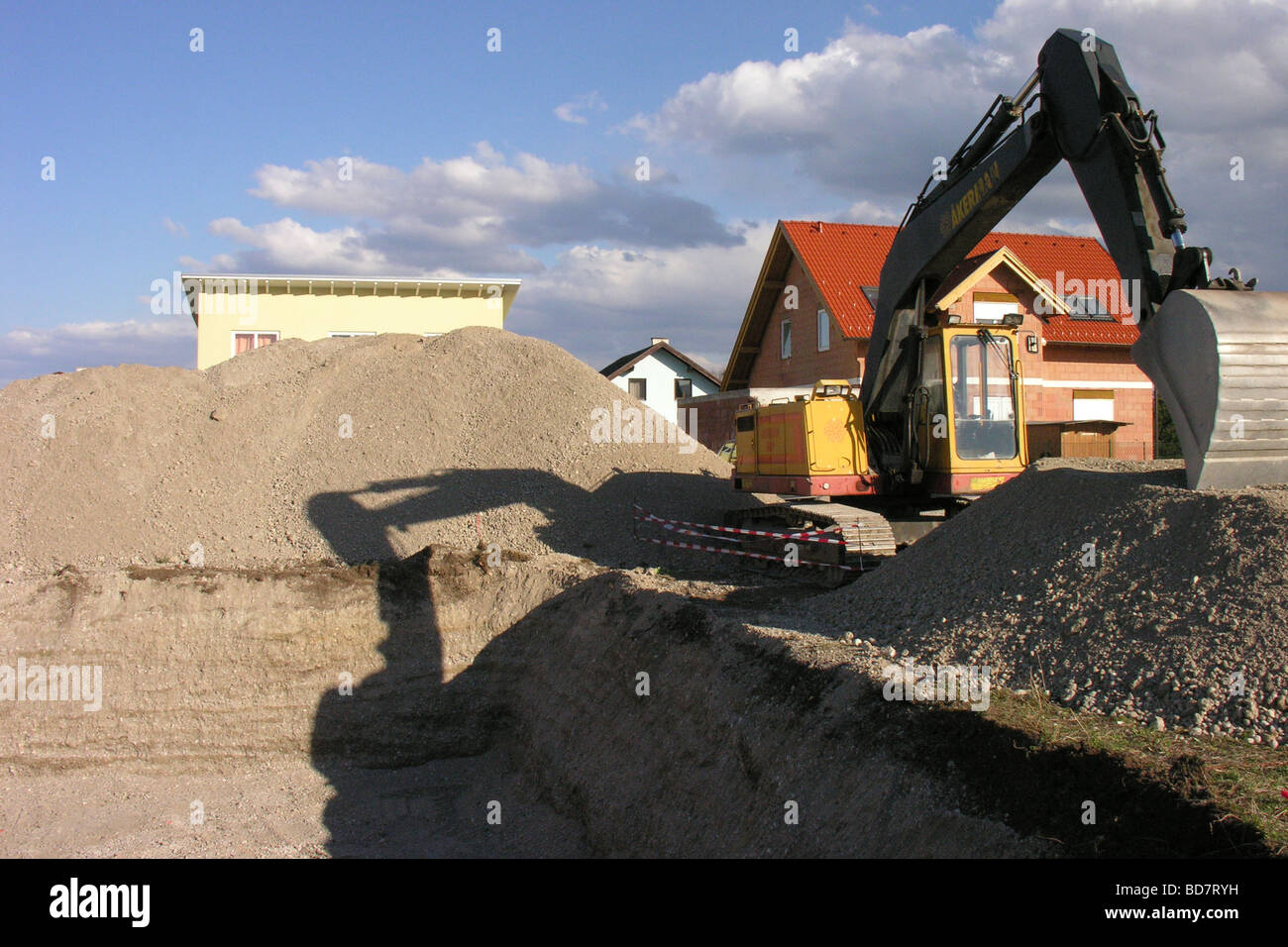 digger digging cunstruction trench Stock Photo - Alamy