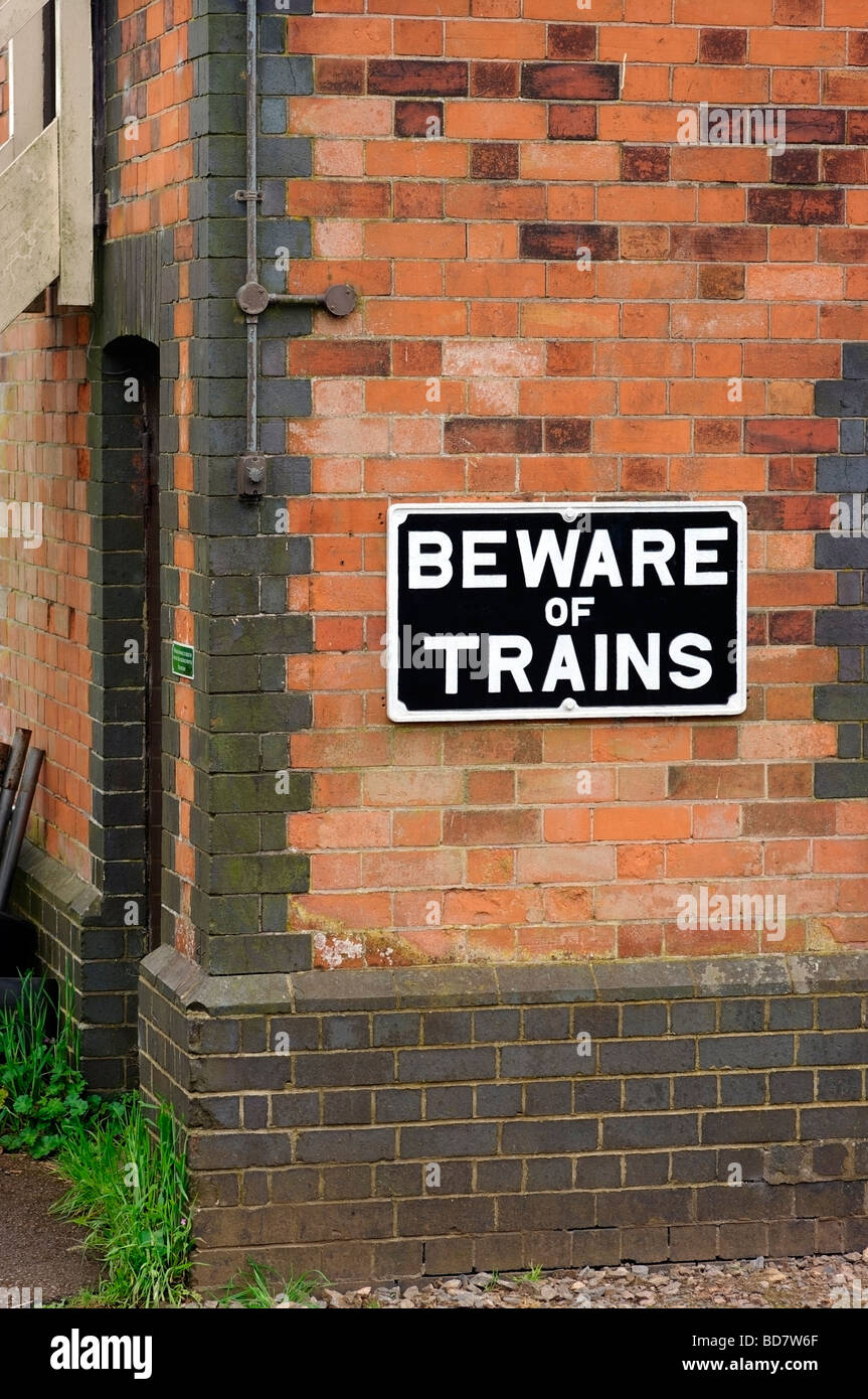 Beware of Trains sign Stock Photo - Alamy
