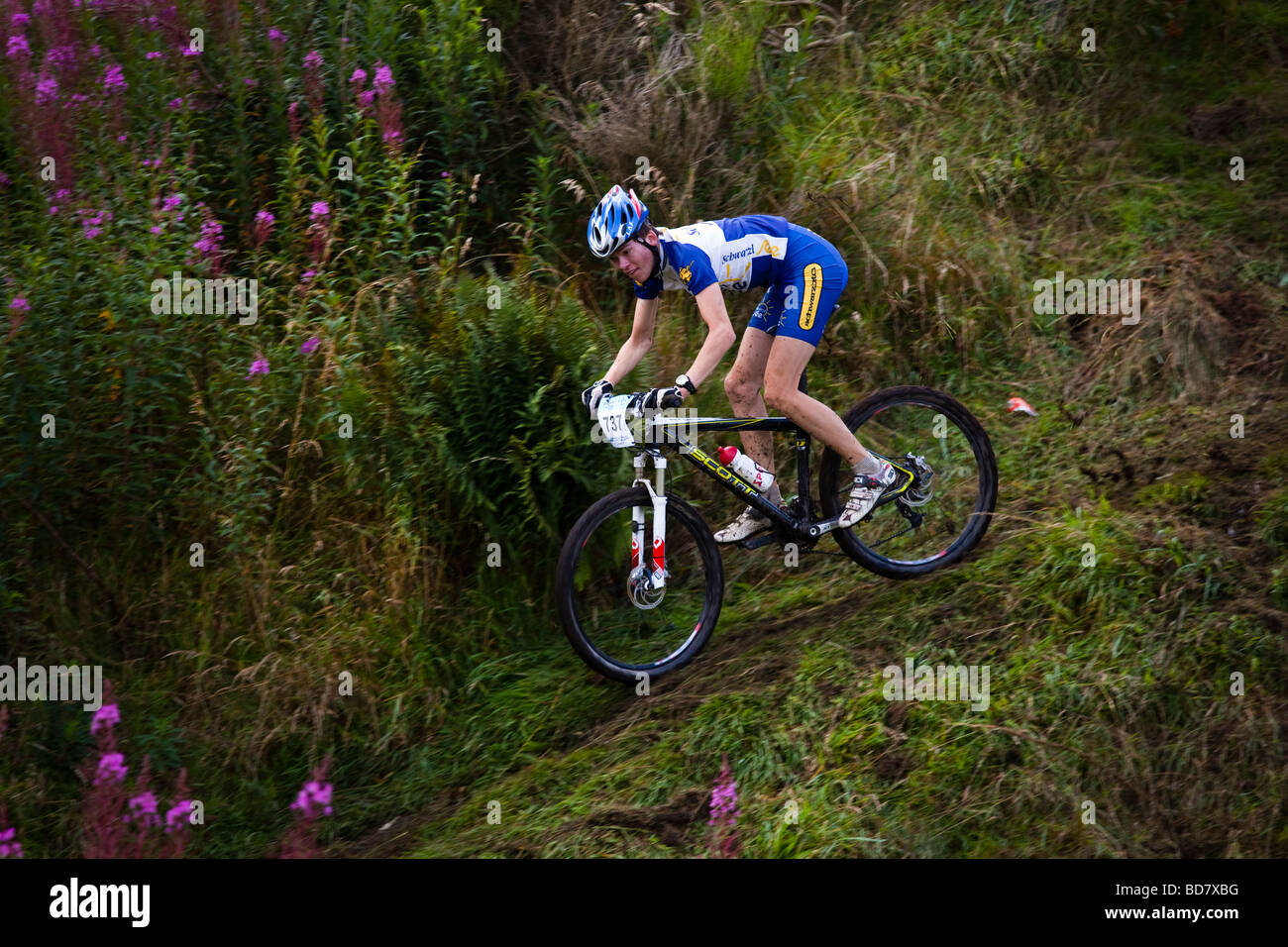 Mountain bike rider riding downhill during a race at Cathkin Braes ...