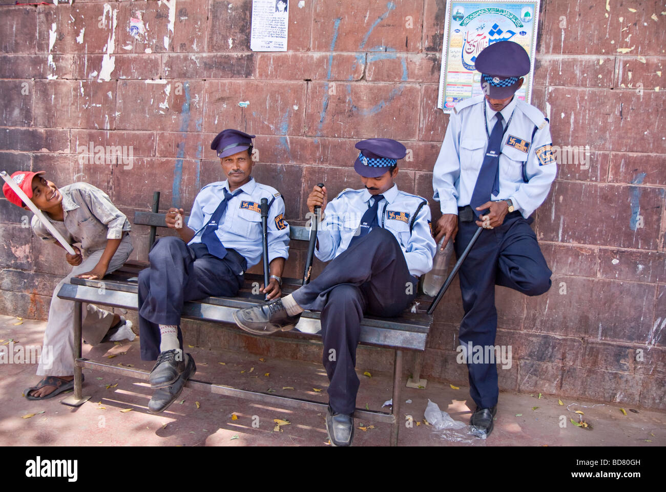 policemen relaxing, sitting down Stock Photo - Alamy