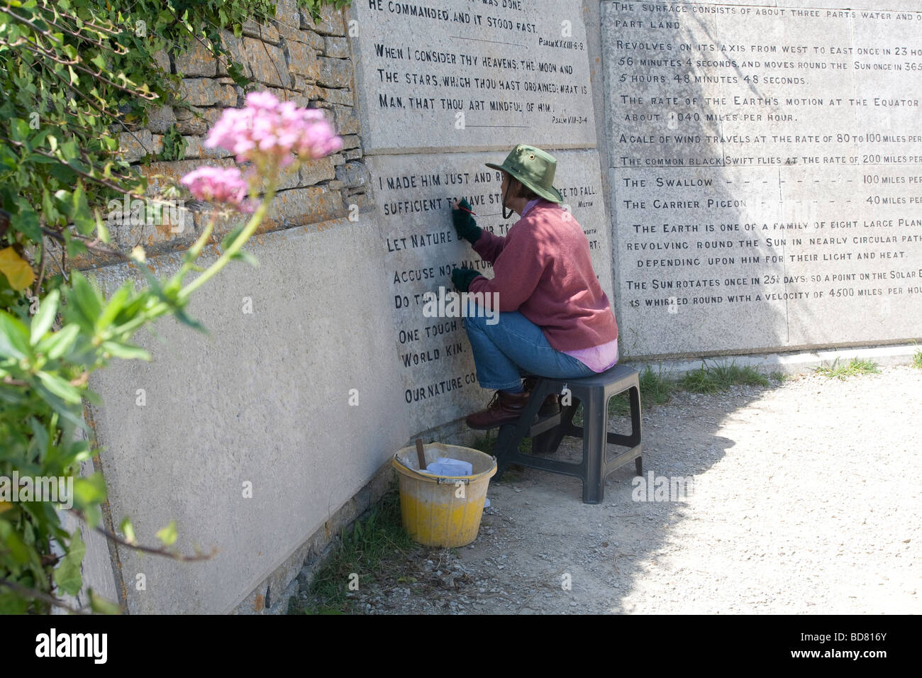 An expert conservator works to restore a stone inscription at the Large ...
