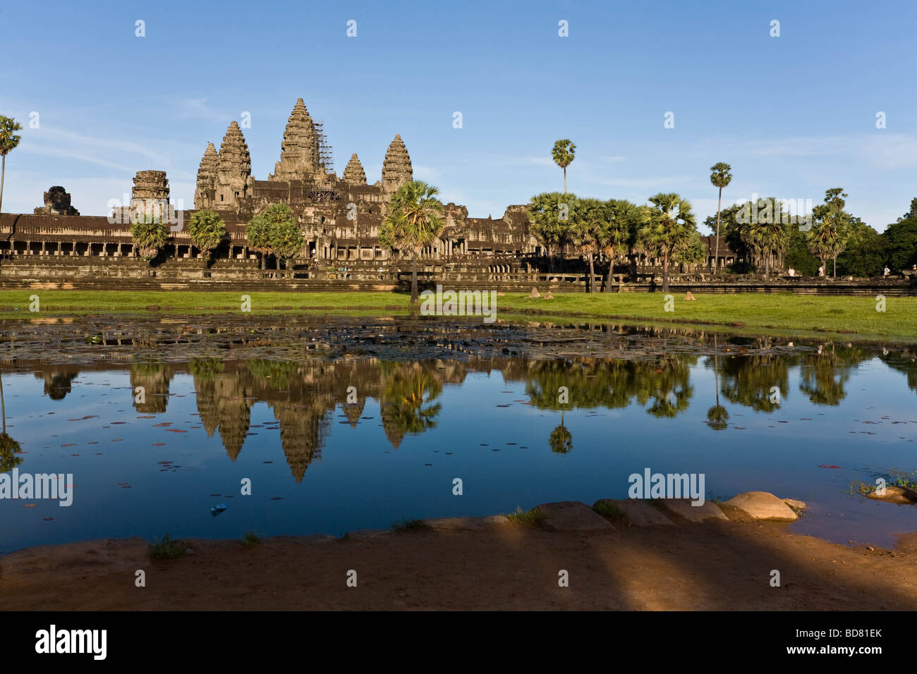 Classic view of Angkor Wat across the pools with a clear reflection ...