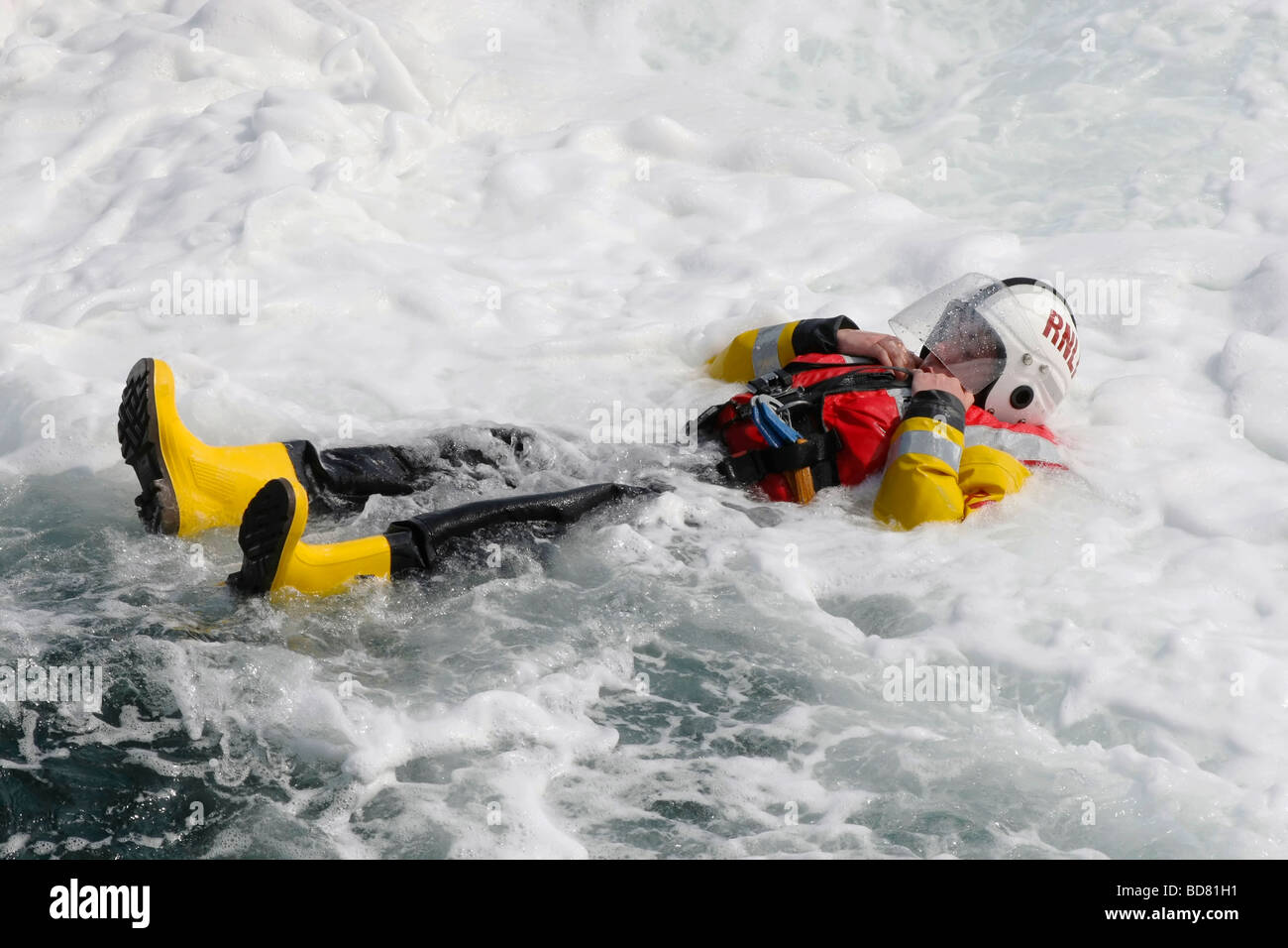 An RNLI crewman practising man over board drills Stock Photo - Alamy