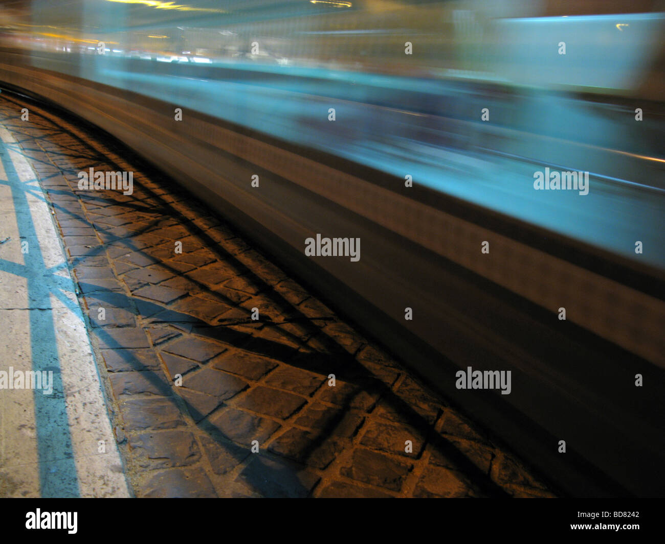 fast metro tram carriage on tracks in city at night Stock Photo - Alamy