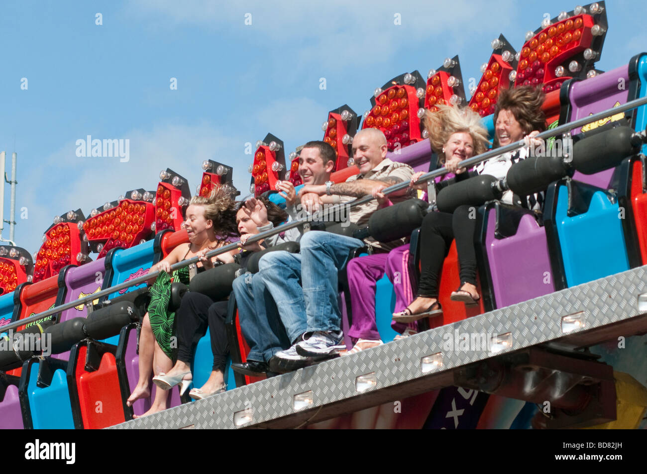 adults enjoying a "fairground ride Stock Photo - Alamy