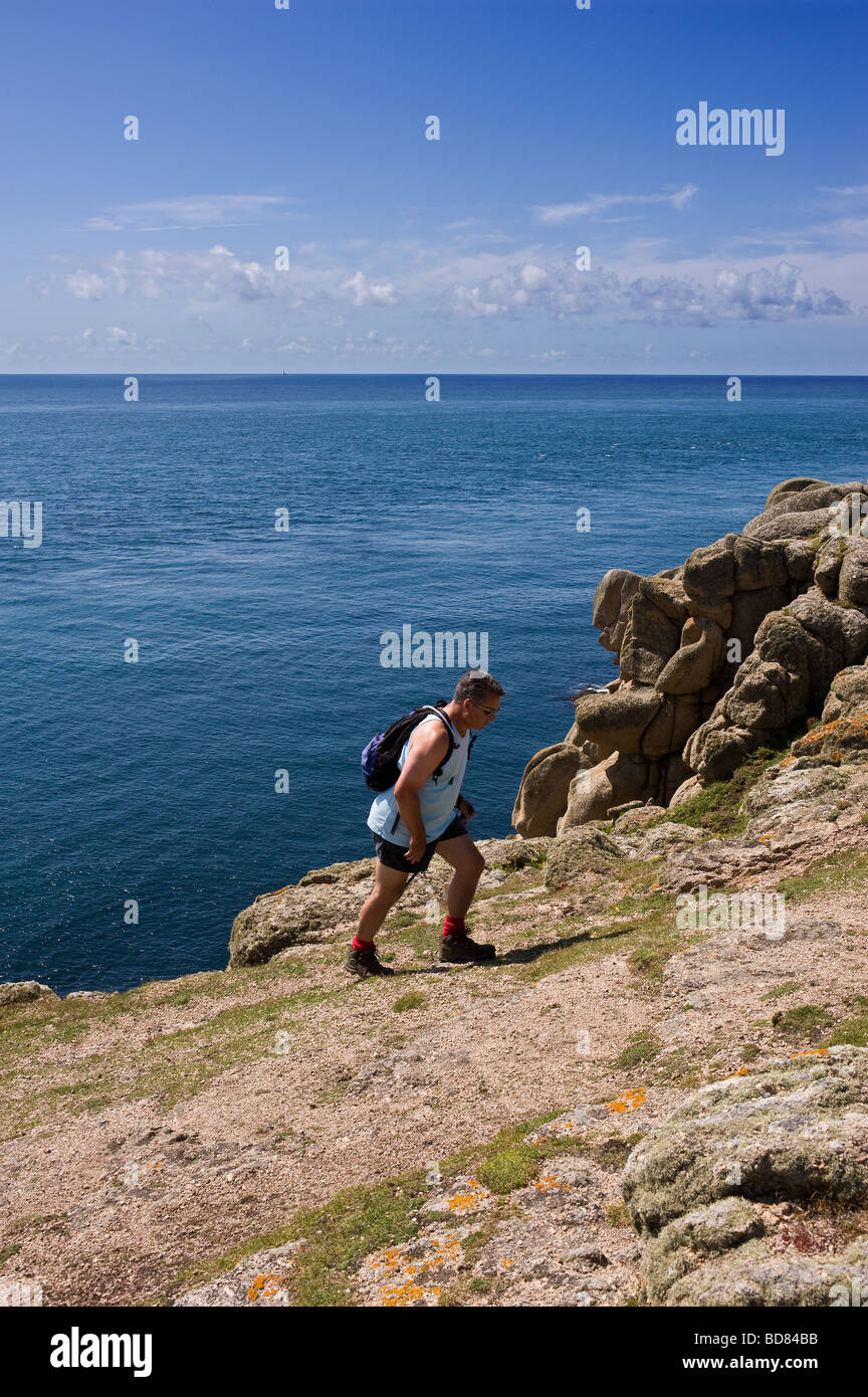 A rambler walking along the coastal path in Cornwall. Photo by Gordon ...