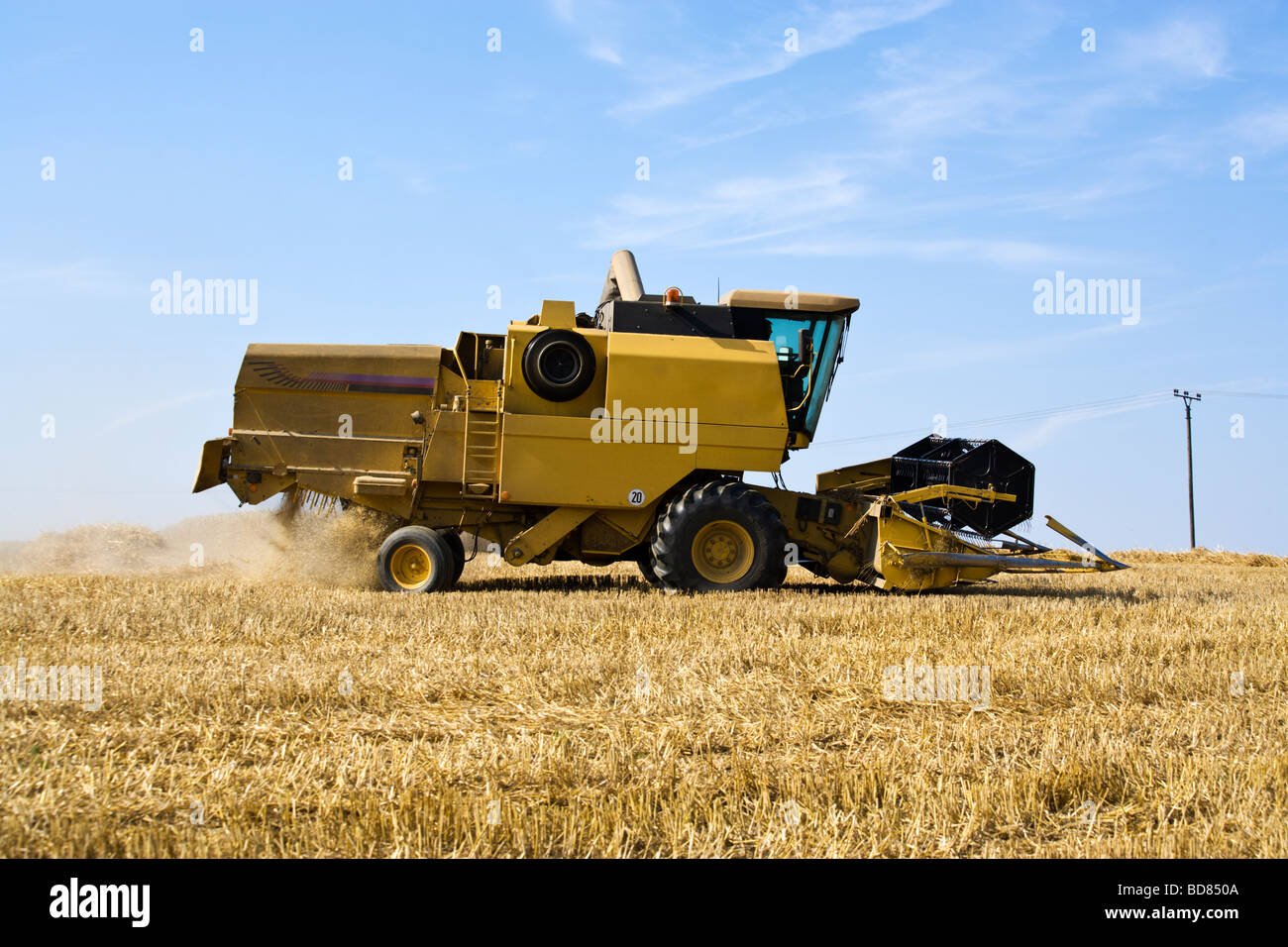 Wheat harvesting - harvester on field, view from right side Stock Photo ...