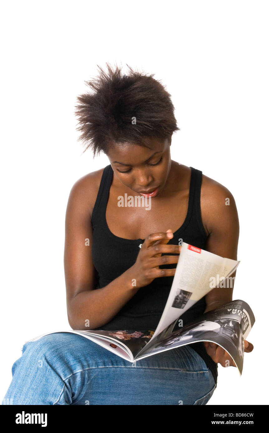 Vertical close up portrait of an attractive African woman flicking over ...