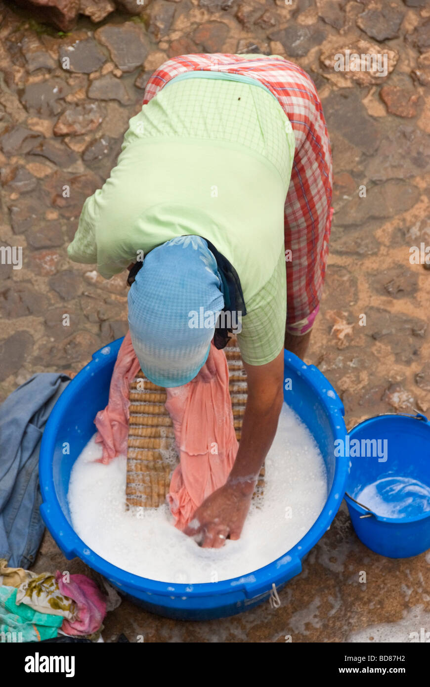 Moroccan woman washing clothes the traditional way down at the river ...