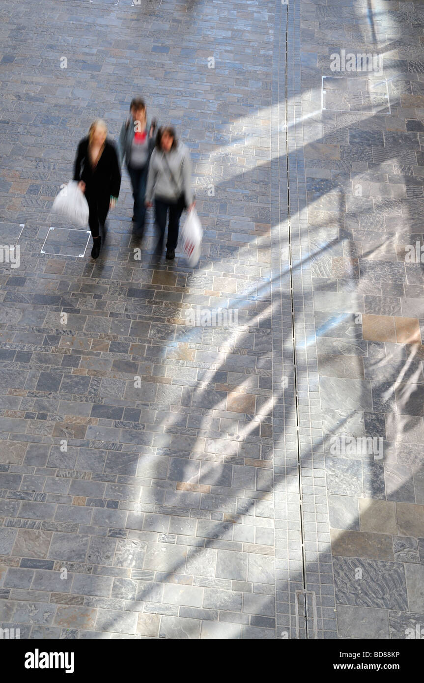 Three abstract figures walking Stock Photo - Alamy