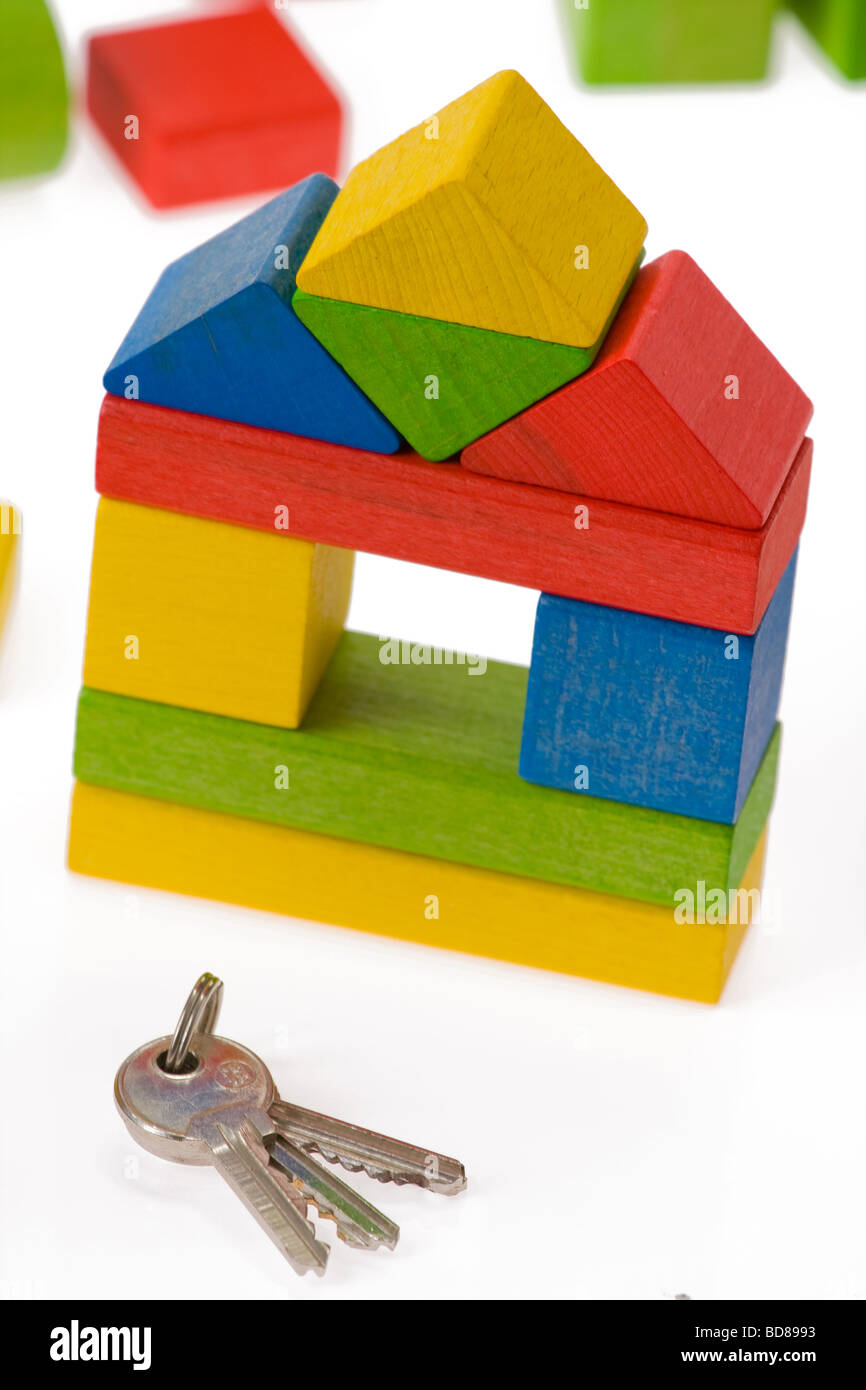 Wooden toy blocks and keys on white background Stock Photo - Alamy