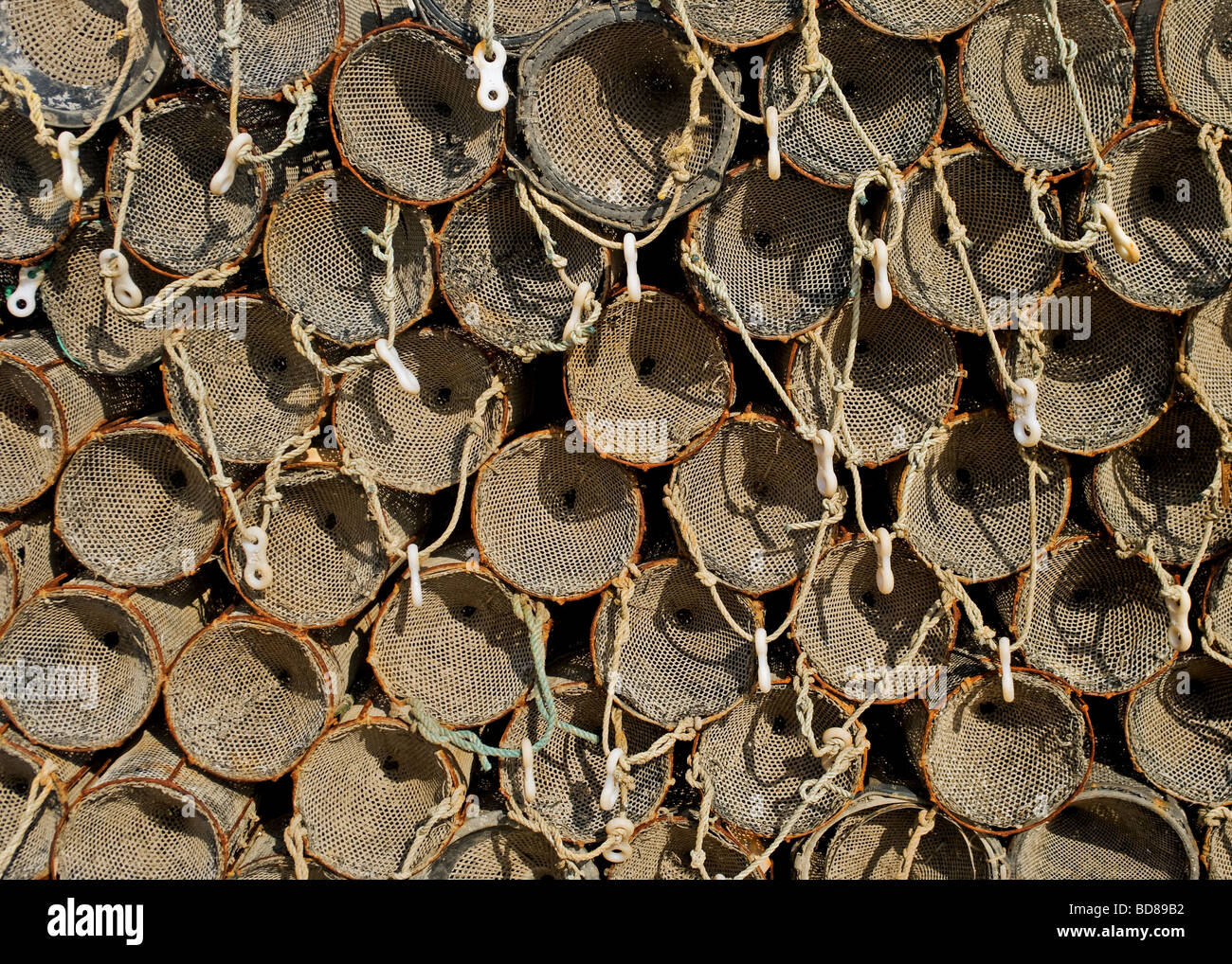 prawn pots stacks on the quayside of Aberaeron Harbour West Wales in ...