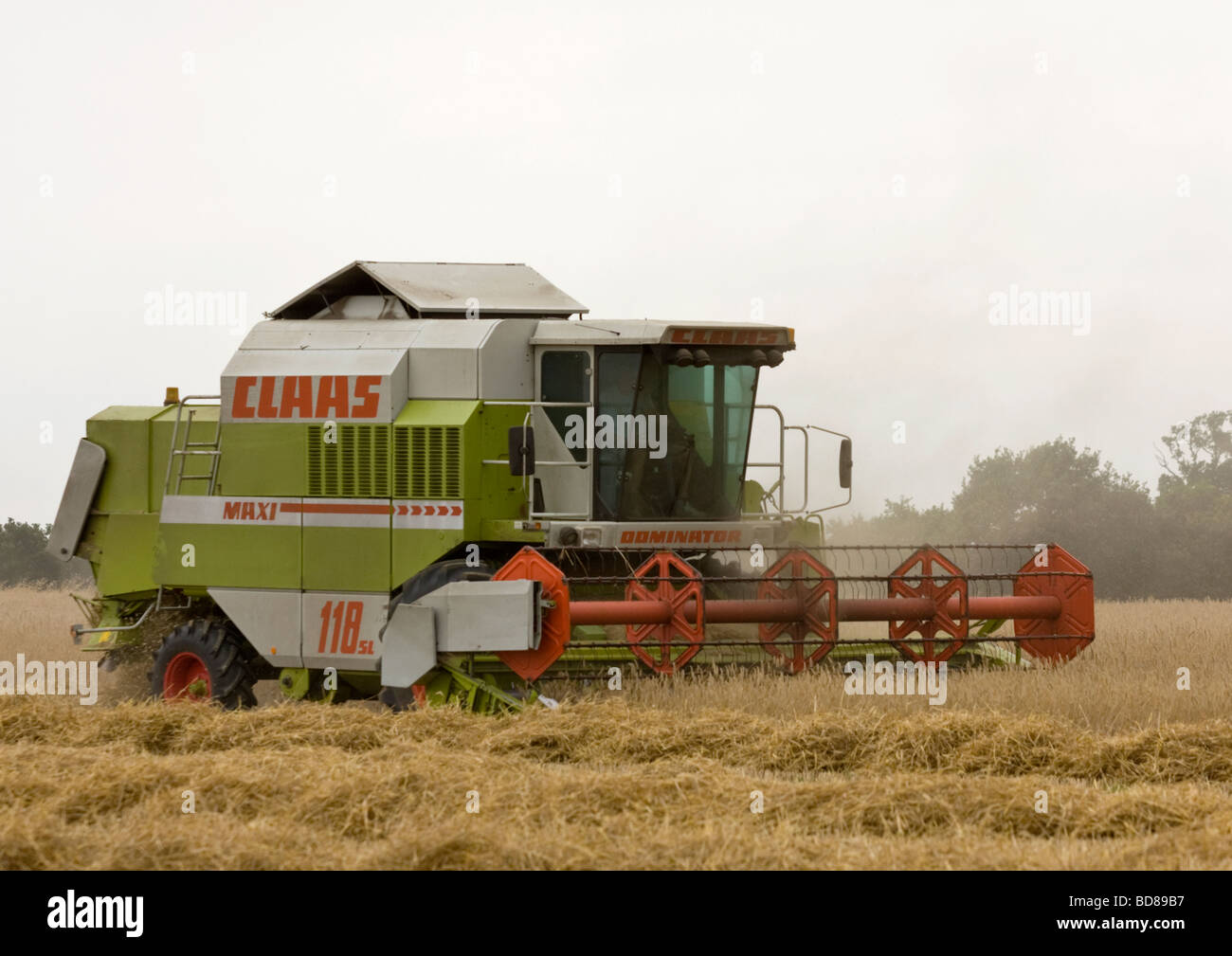 Combine harvester in field of wheat Stock Photo - Alamy