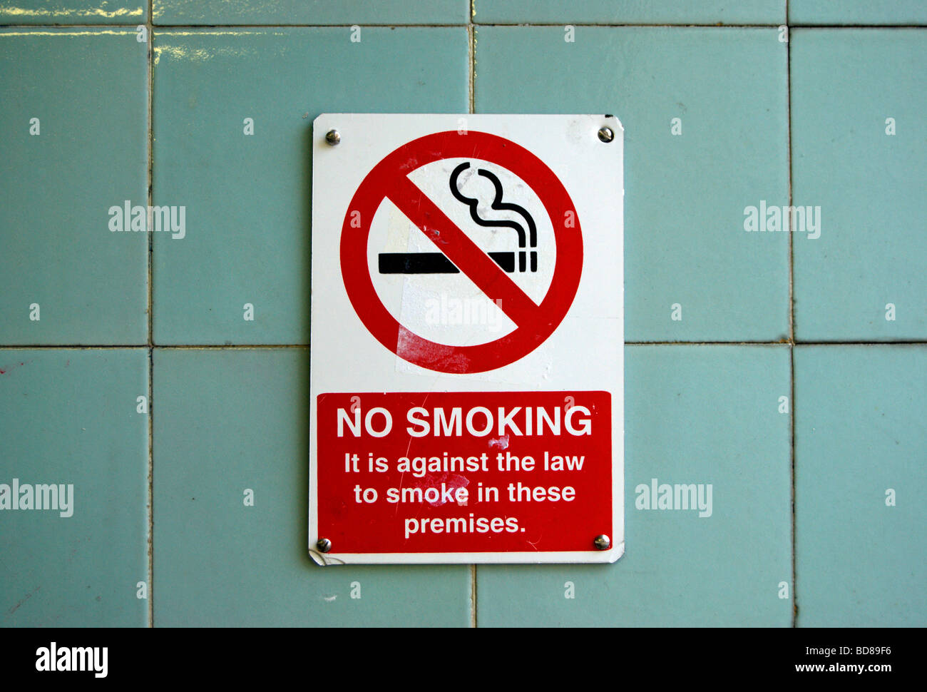 no smoking sign on the tiled wall of a subway under the A4 in chiswick ...