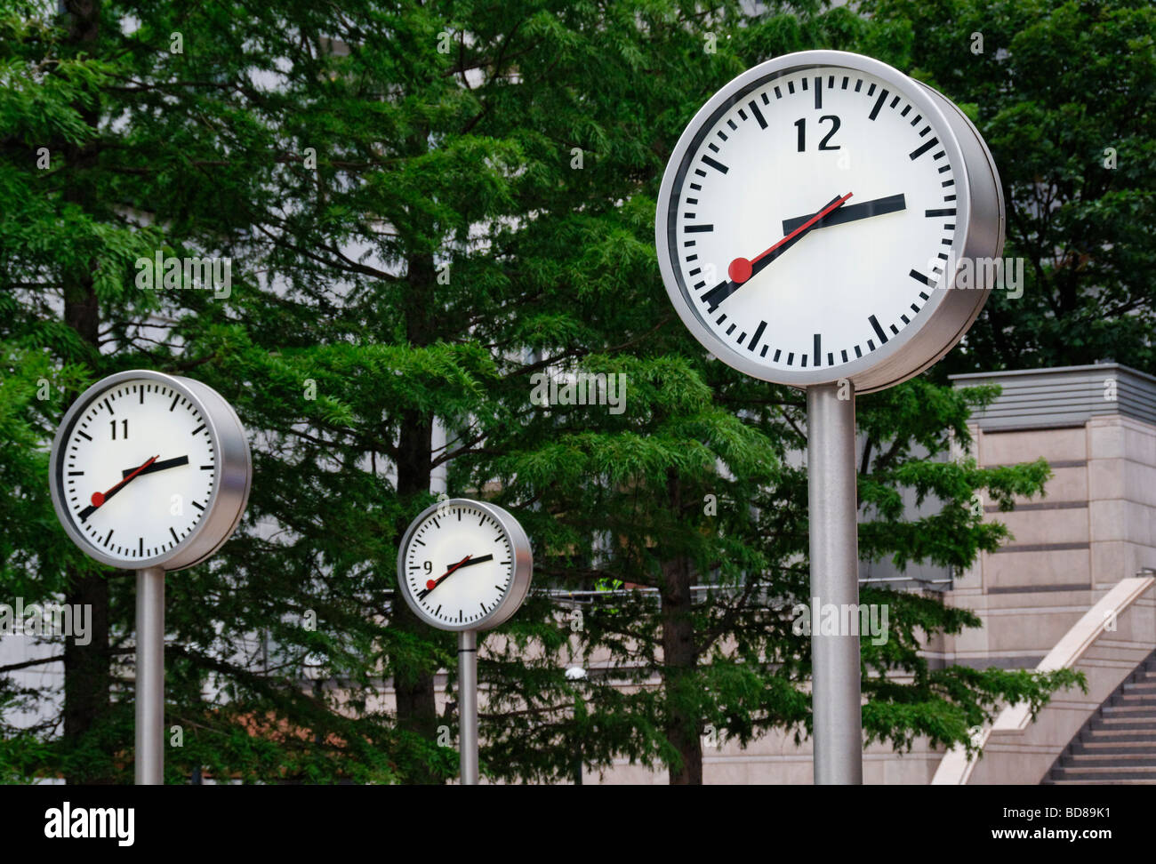 Three clocks displayed on the street Stock Photo - Alamy