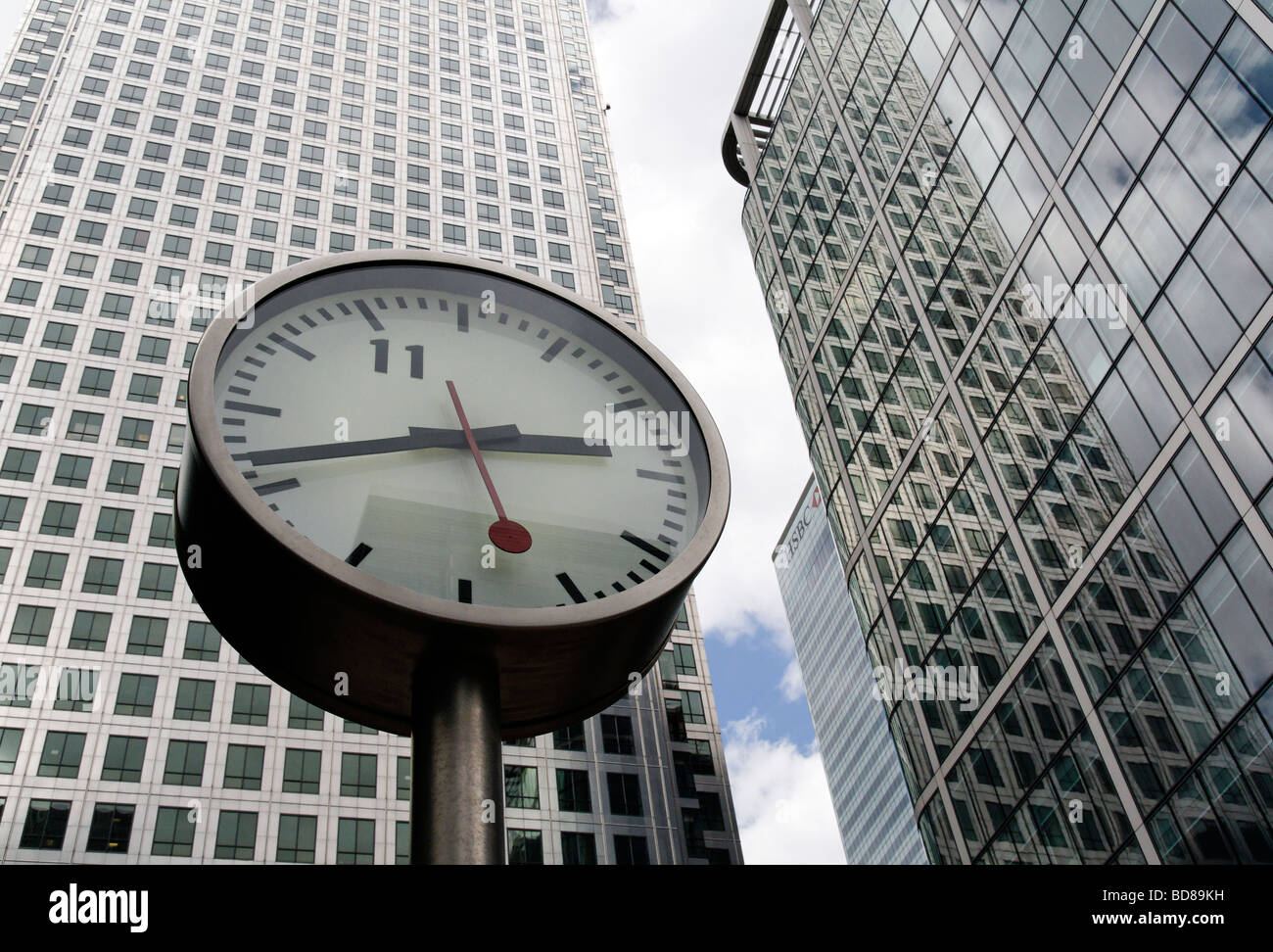 Clock displayed in front of office buildings Stock Photo - Alamy