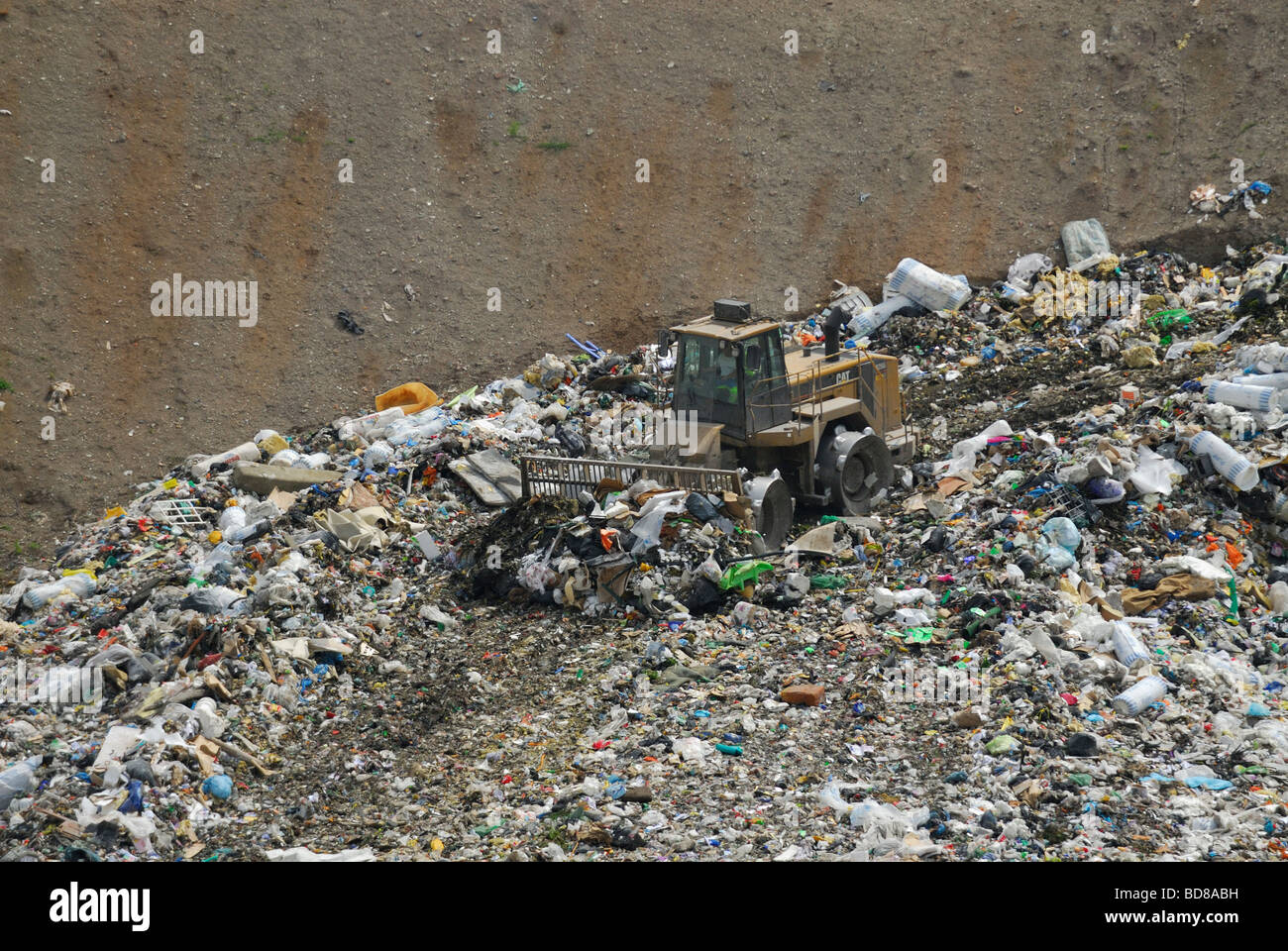 A tractor compactor working in a landfill site in France. (Lorraine ...