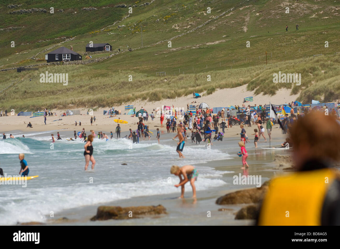 Crowd of bathers on Sennen Cove beach in Cornwall, UK Stock Photo - Alamy