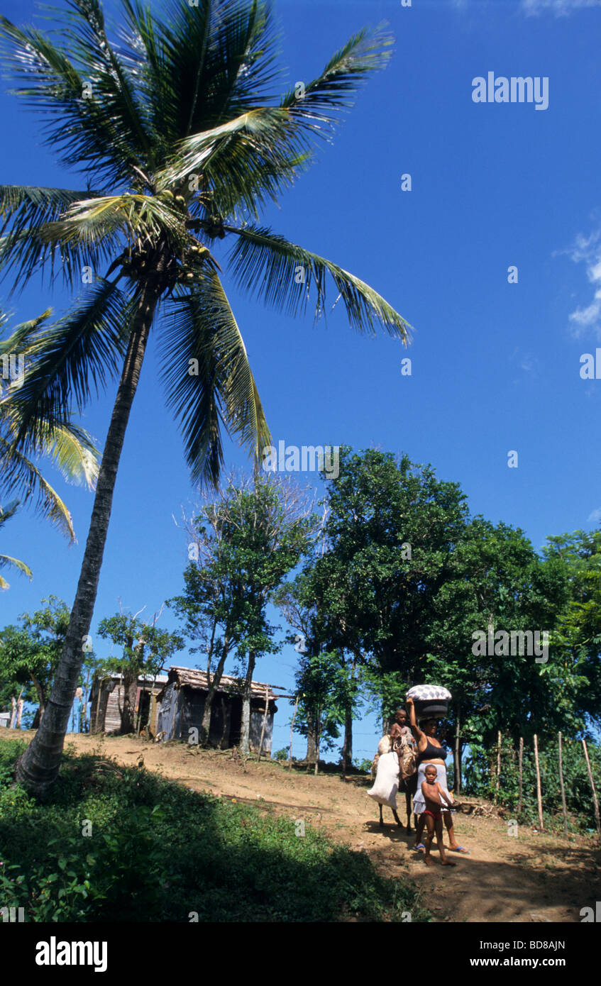 Countryside with poor houses and people in La Altagracia province in ...