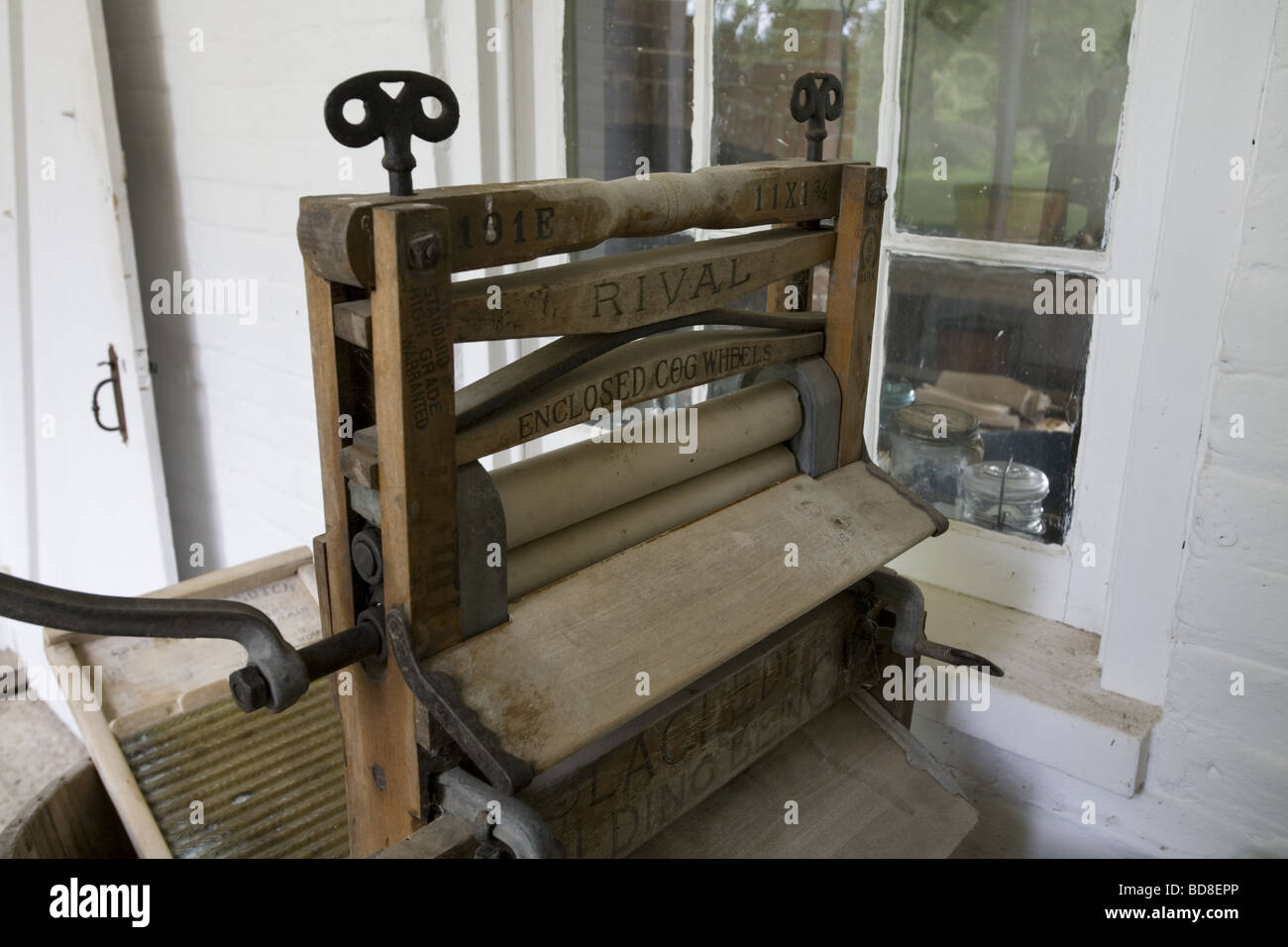 Old laundry machine for press water out of cloth Stock Photo - Alamy