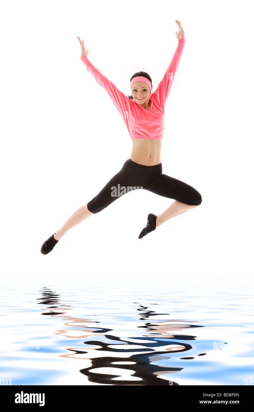 picture of happy girl jumping over water Stock Photo - Alamy