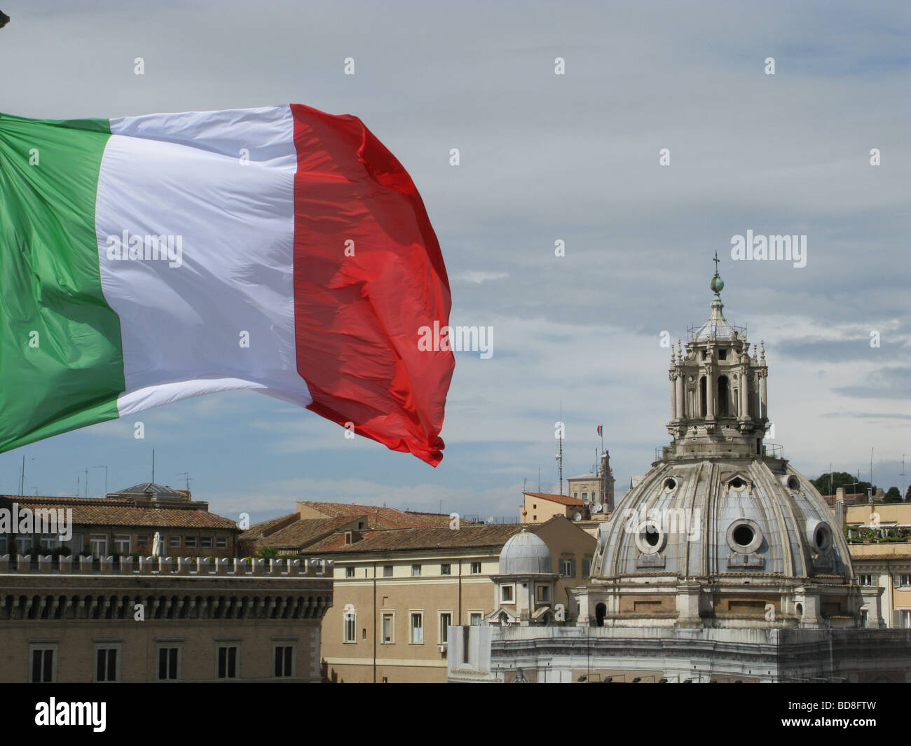 italy flag on vittoriano with santa maria di loreto church, rome Stock ...