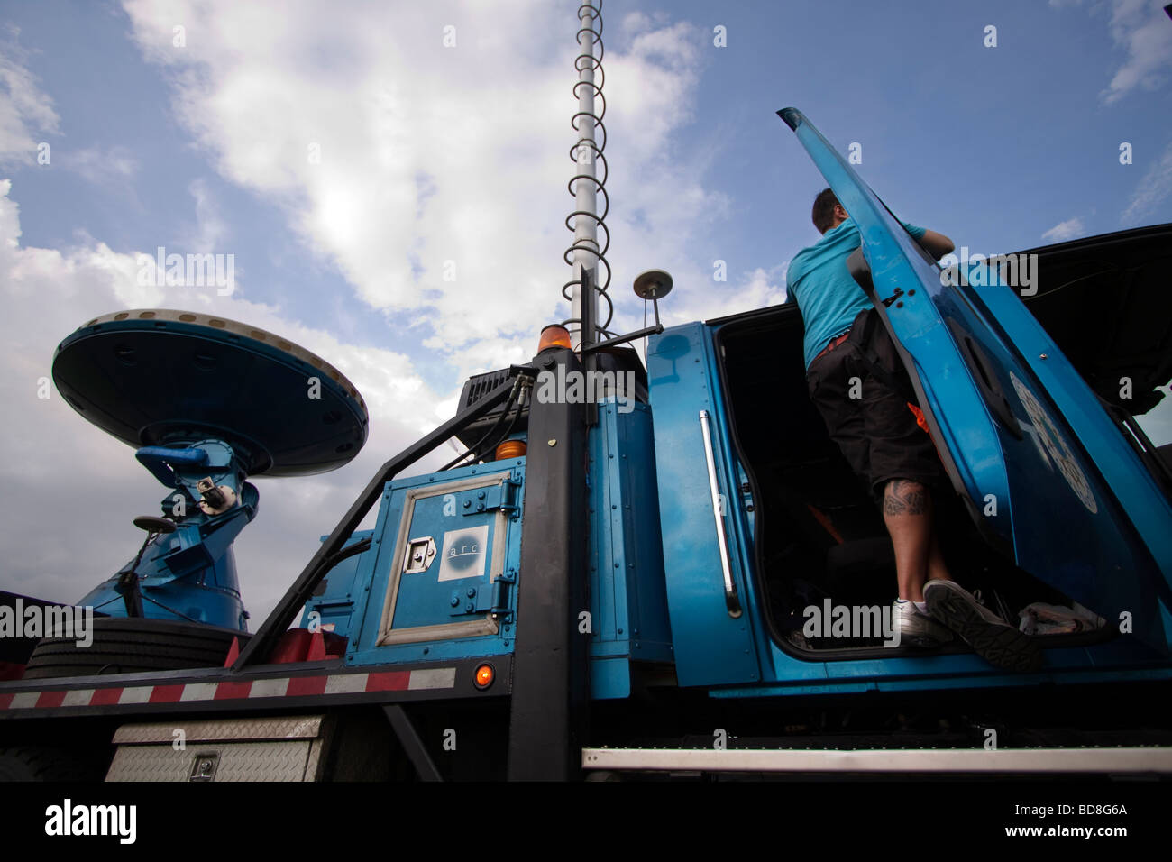 Justin Walker of the Center for Severe Weather Researcher stands outide ...