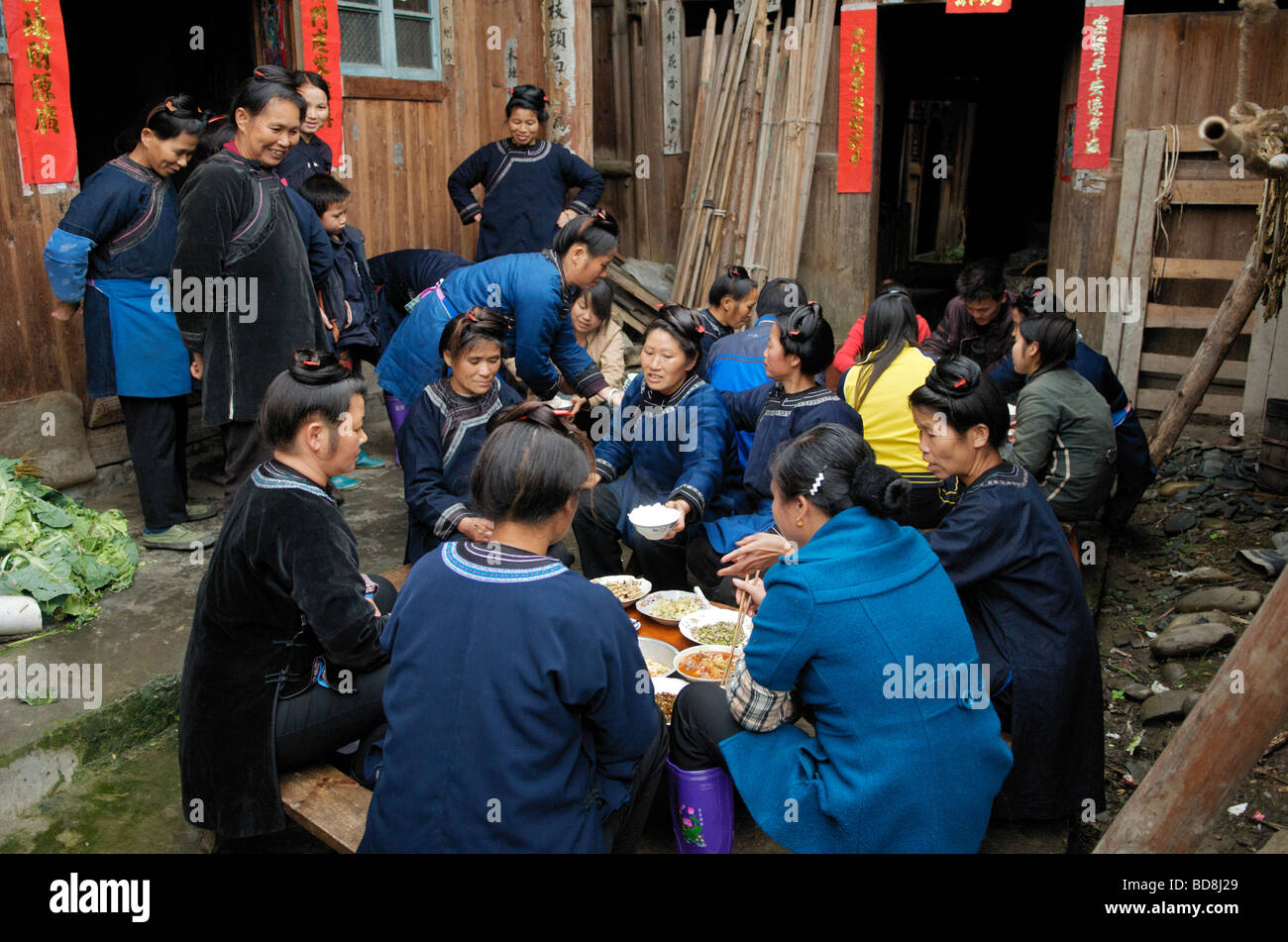 Dong women eating at wedding feast Chejing village Guizhou Province ...