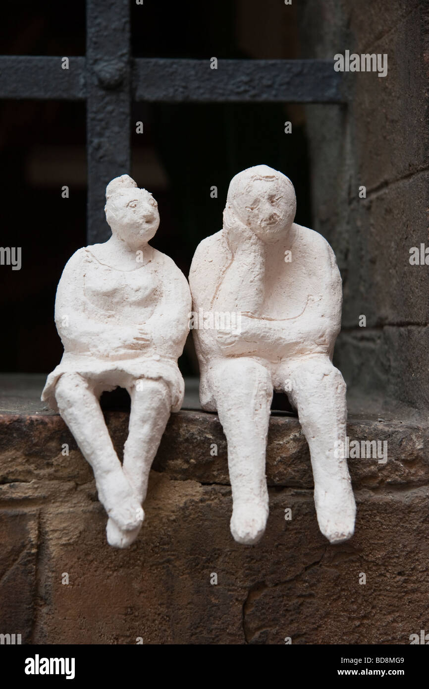 Small statues sitting on window board in Siena Tuscany Italy Stock ...