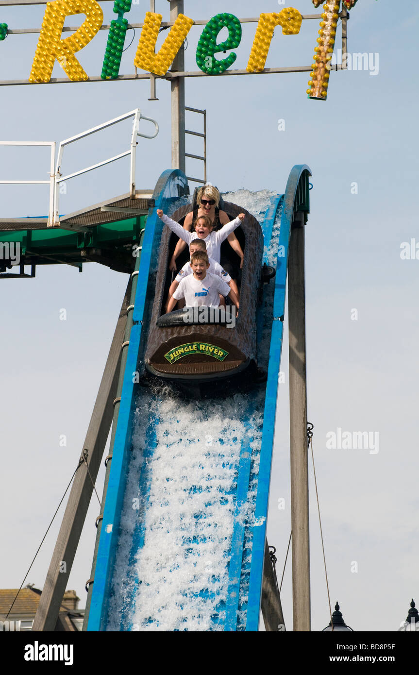 Tourists riding in Jungle River log flume water chute ride, Bridlington ...