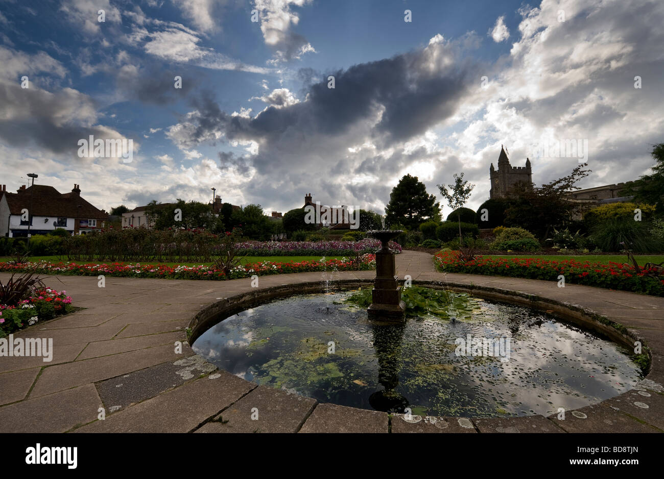 A public fountain within old Amersham memorial gardens against a ...
