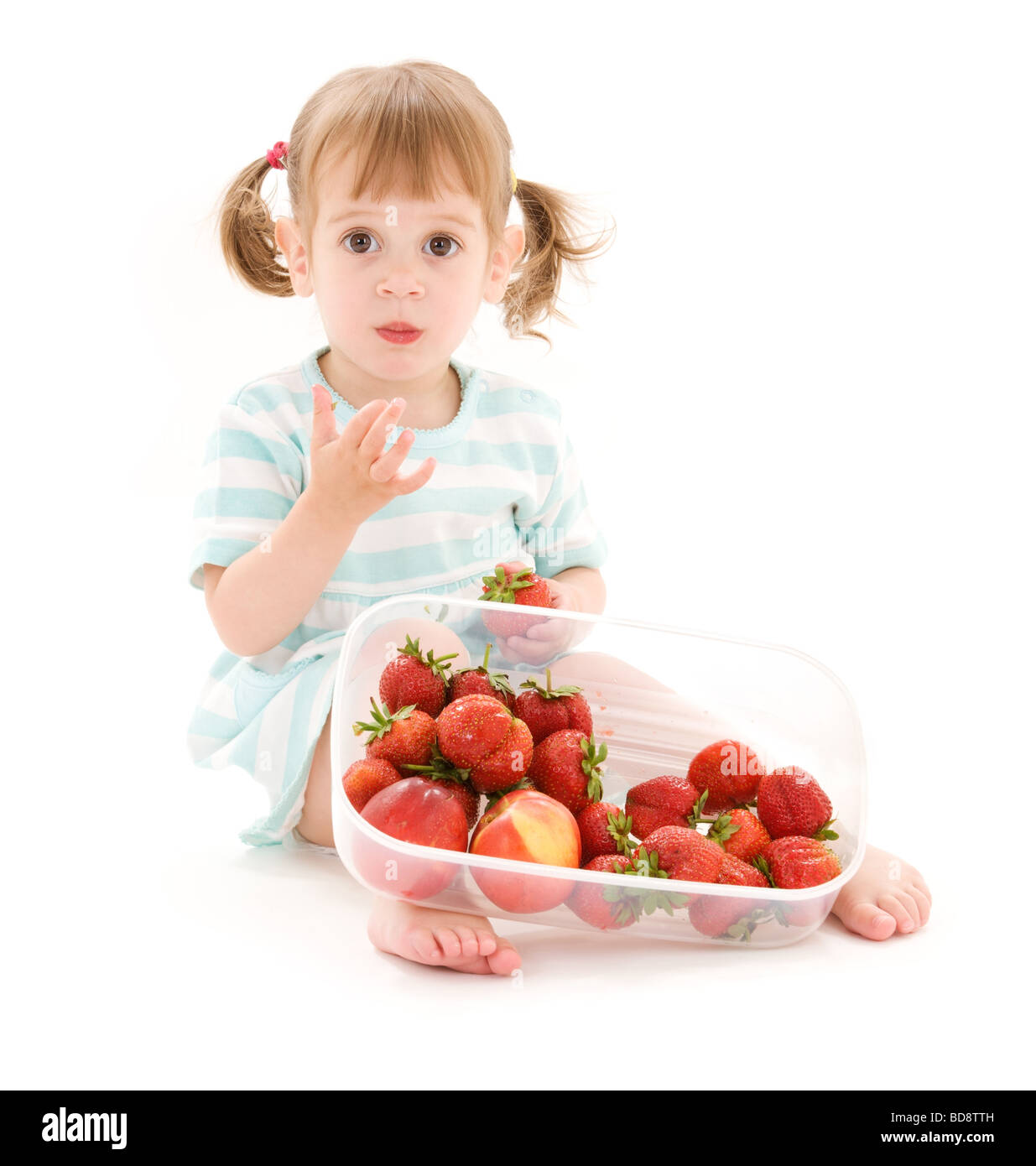 picture of little girl with strawberry over white Stock Photo - Alamy