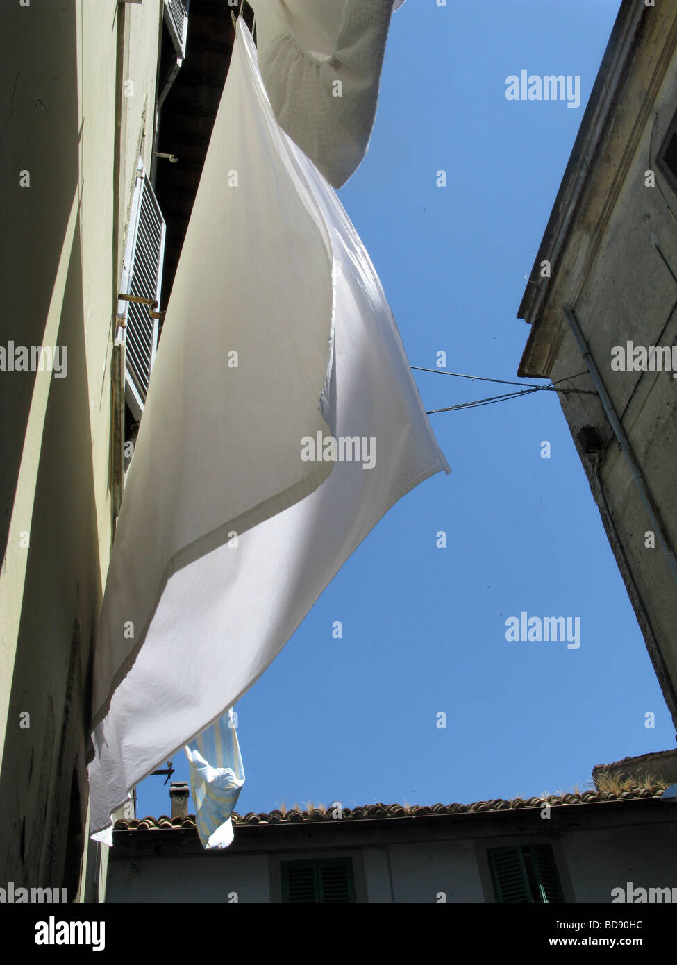 bed sheets on washing line outdoors in sun in italy Stock Photo - Alamy