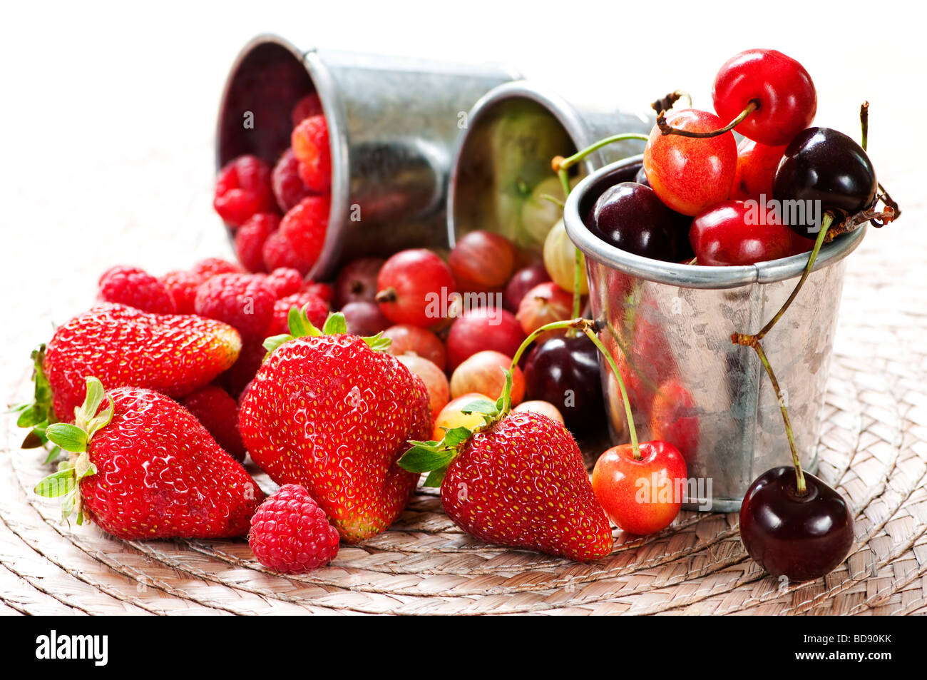 Assorted summer fruits and berries in metal pails Stock Photo - Alamy