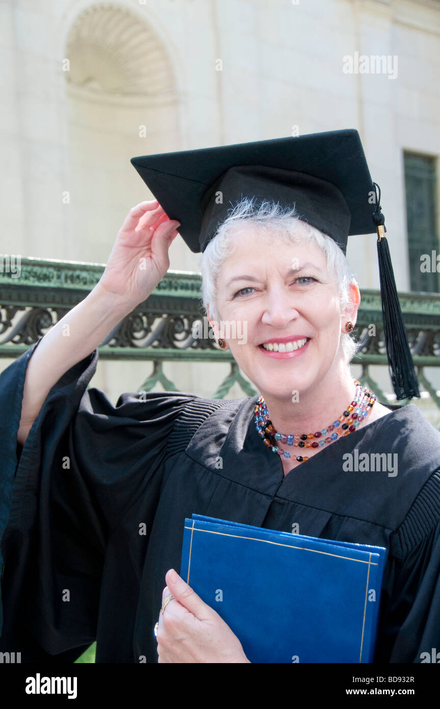 Woman Graduate in Cap and Gown Stock Photo - Alamy