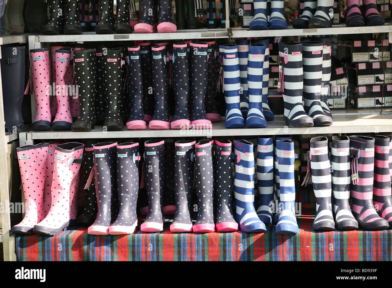 Multi coloured boots for sale at the Ellingham country fair Stock Photo ...