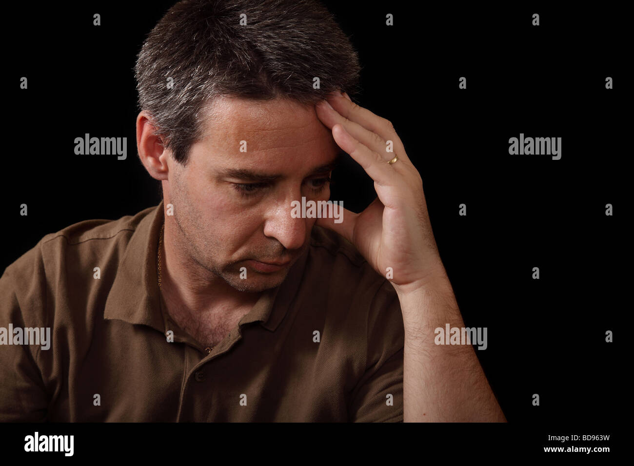 portrait of a sad man over the black background Stock Photo - Alamy