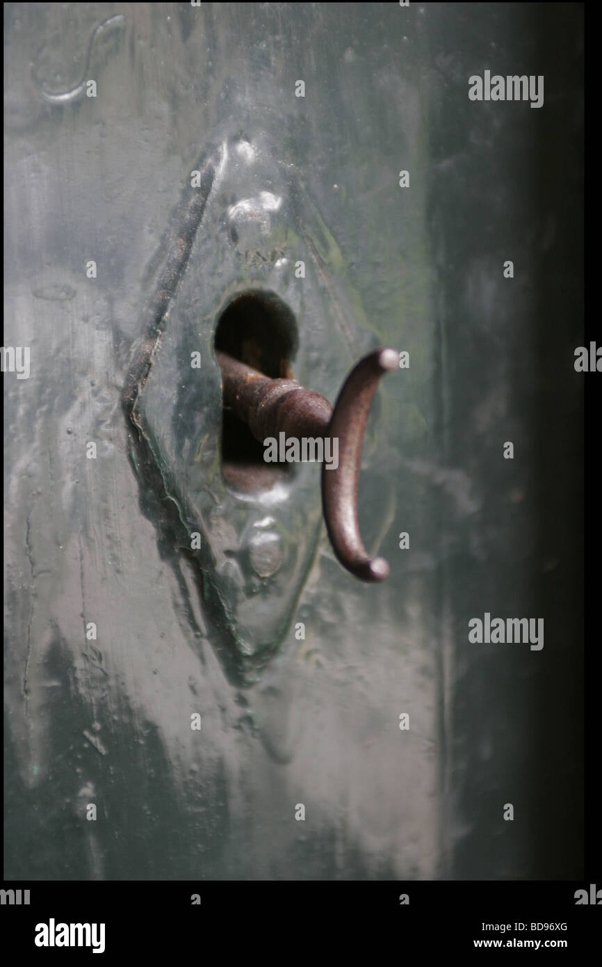 Close up keyhole and key in door Stock Photo - Alamy