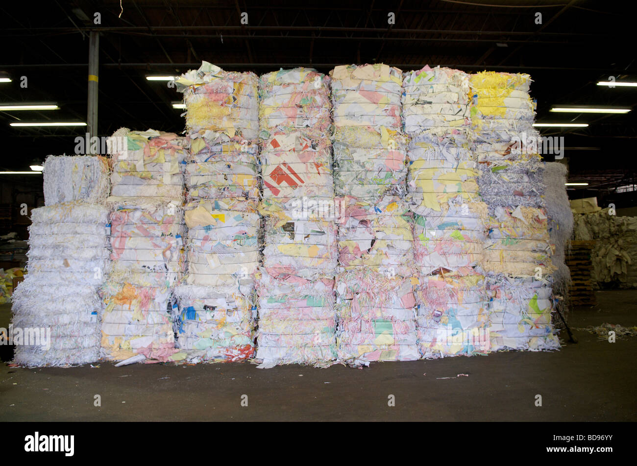 Recycling. Bales of paper stacked on the floor and waiting for shipping ...
