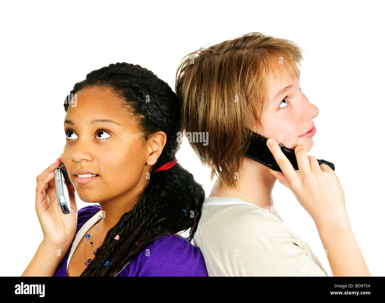 Isolated portrait of two teenage girls with cell phones Stock Photo - Alamy