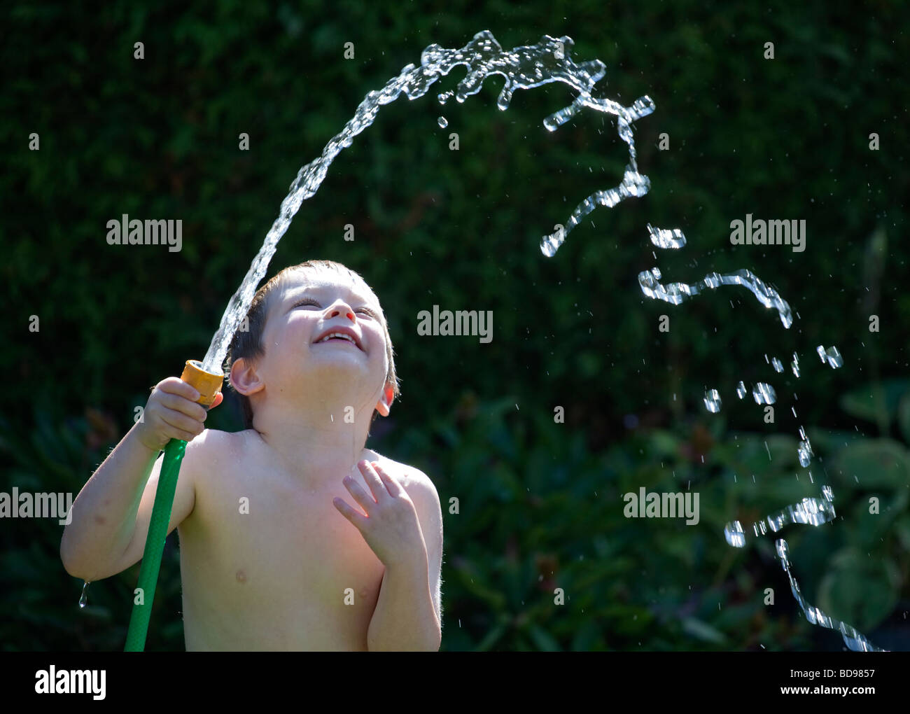 Boy hose pipe hi-res stock photography and images - Alamy