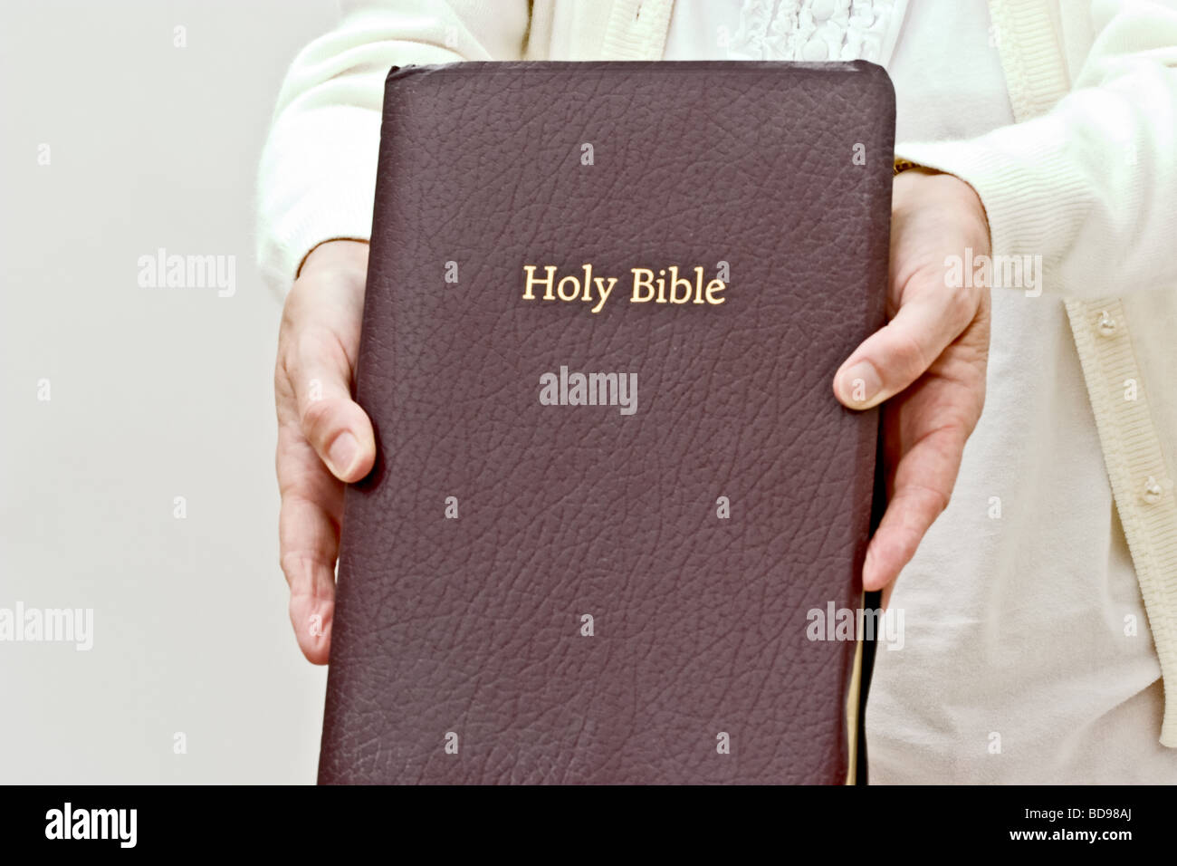Woman holding bible two hands hi-res stock photography and images - Alamy
