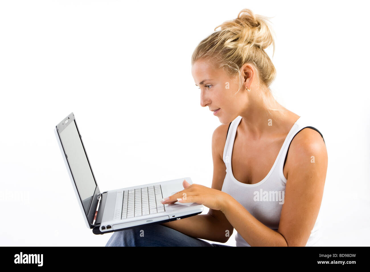Blonde girl working on computer isolated on white background Stock ...