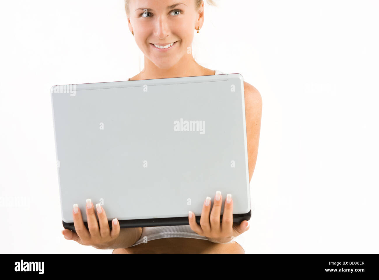 Blonde happy young girl holding computer in her hands Stock Photo - Alamy