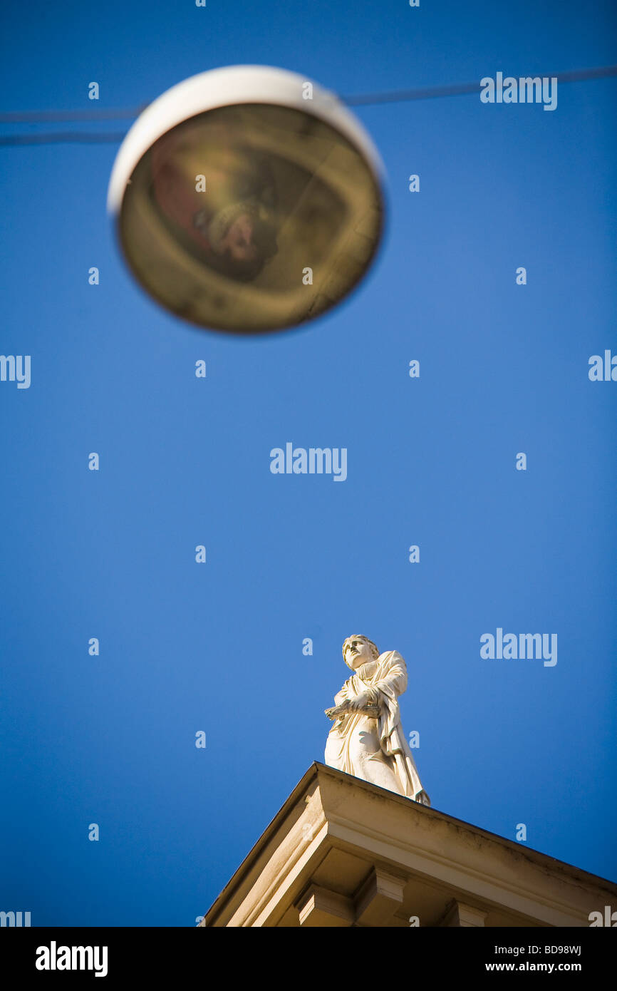A statue on the top of a building with deep blue sky Stock Photo - Alamy