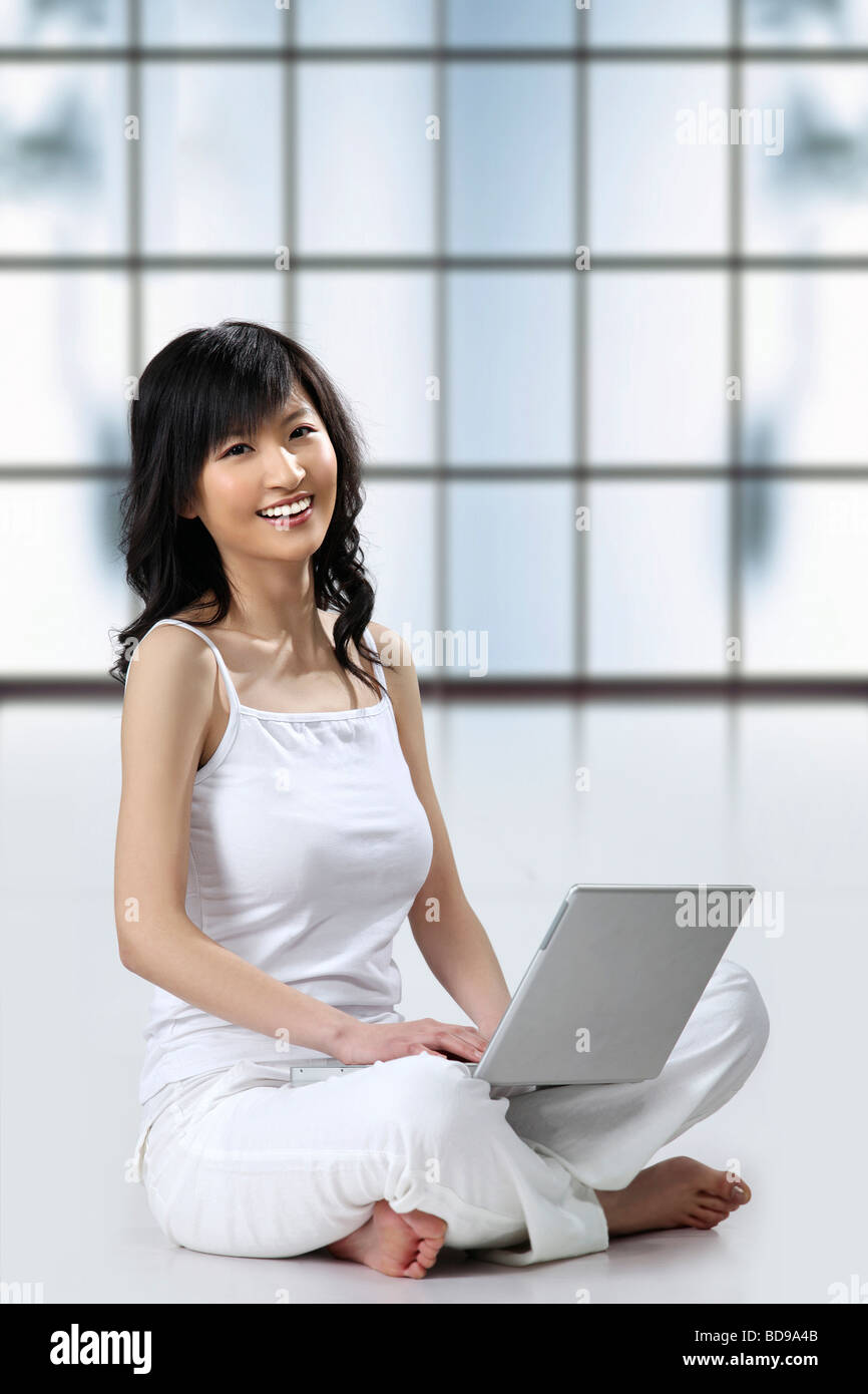 Chinese girl using laptop Stock Photo - Alamy