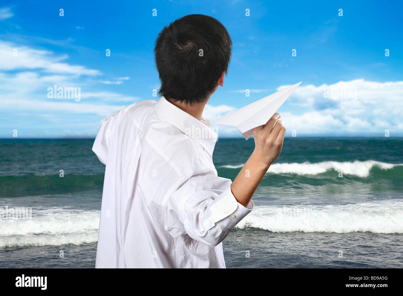 Chinese boy playing paper airplane Stock Photo - Alamy