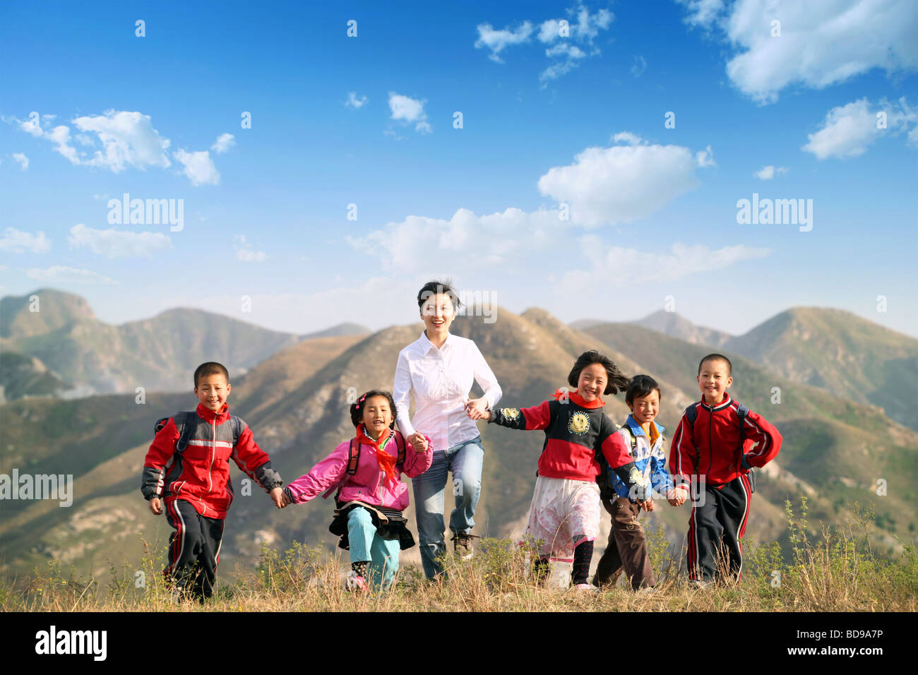 Group cheerful students running in hi-res stock photography and images ...