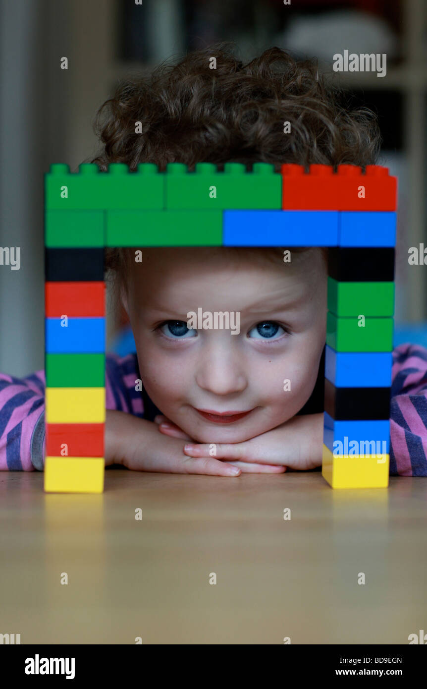 Girl with building bricks Stock Photo - Alamy